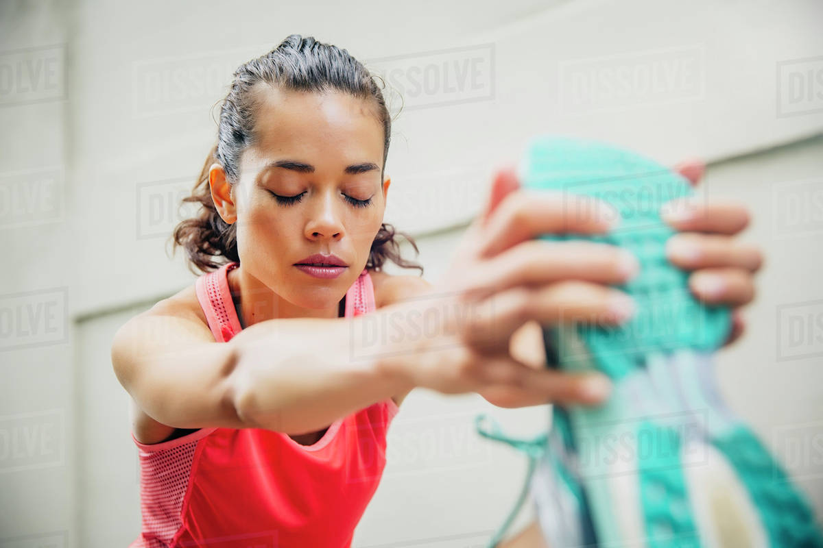 Mixed race athlete stretching outdoors - Royalty-free Stock Photo ...