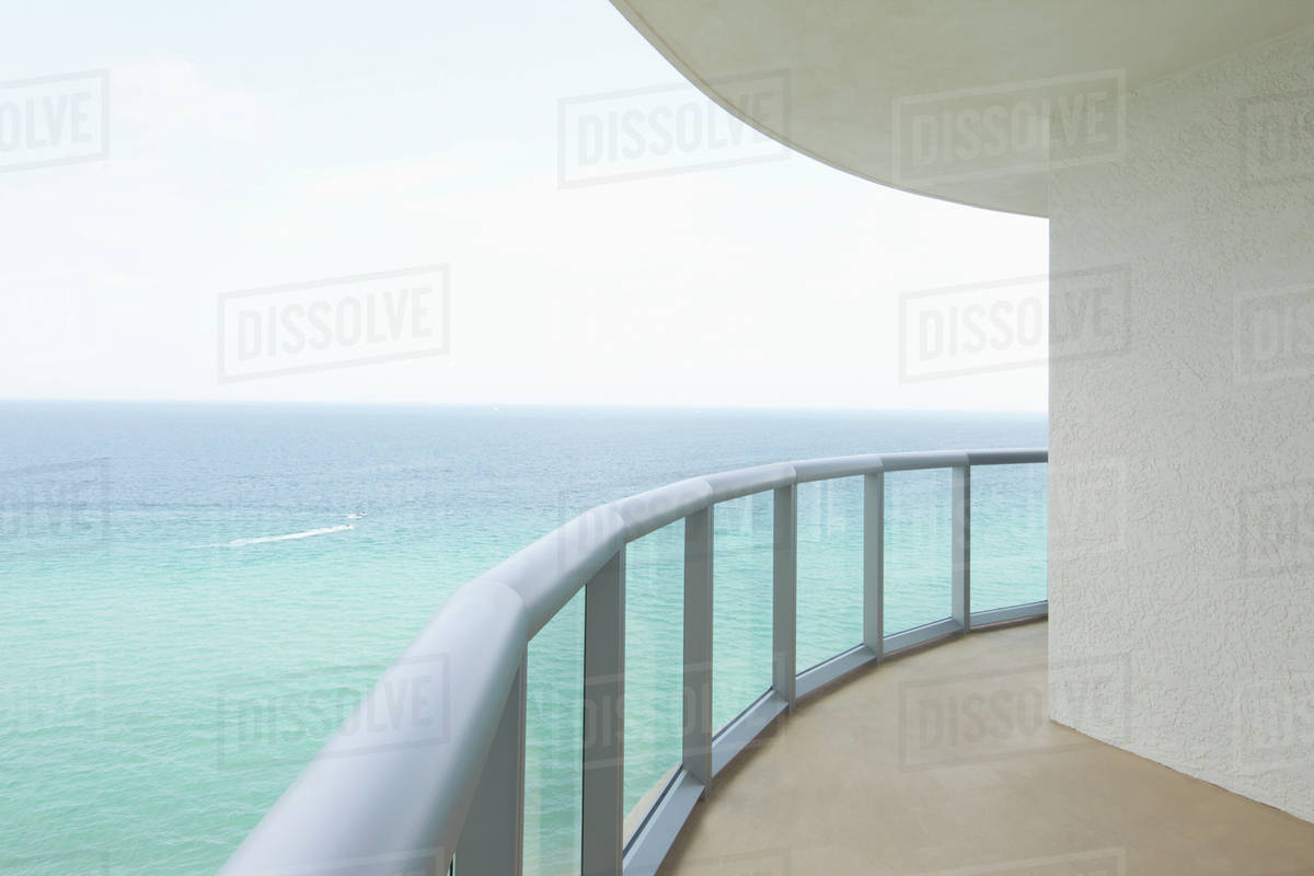 Empty balcony overlooking ocean - Royalty-free Stock Photo | Dissolve