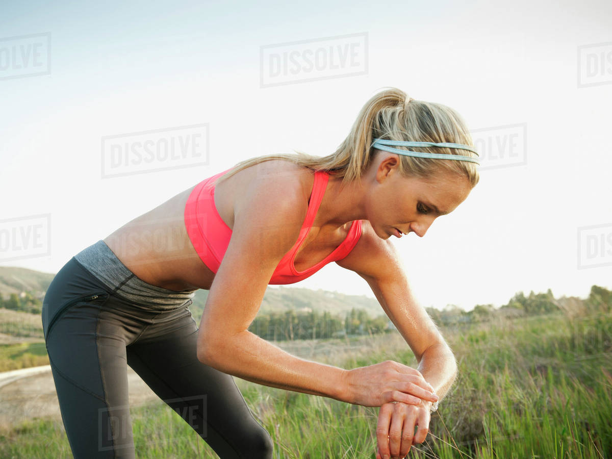 Caucasian woman taking her pulse after exercise - Royalty-free Stock ...