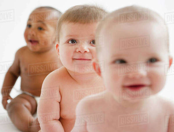 Babies sitting together - Royalty-free Stock Photo | Dissolve