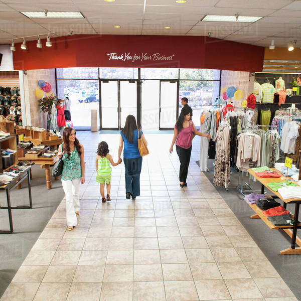 People shopping in clothing store - Royalty-free Stock Photo | Dissolve