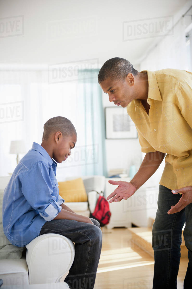 Father lecturing son - Royalty-free Stock Photo | Dissolve
