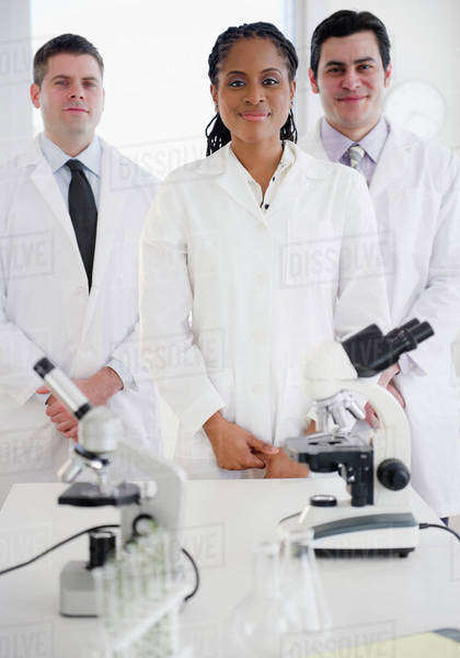 Scientists standing in laboratory - Stock Photo - Dissolve