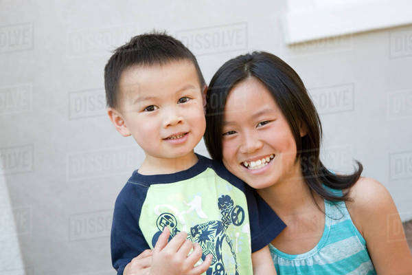 Chinese brother and sister hugging - Royalty-free Stock Photo | Dissolve