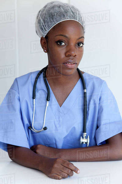 Black doctor in scrubs and surgical cap - Royalty-free Stock Photo ...