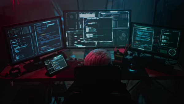 Woman programmer processes information monitoring screens - Stock Video ...