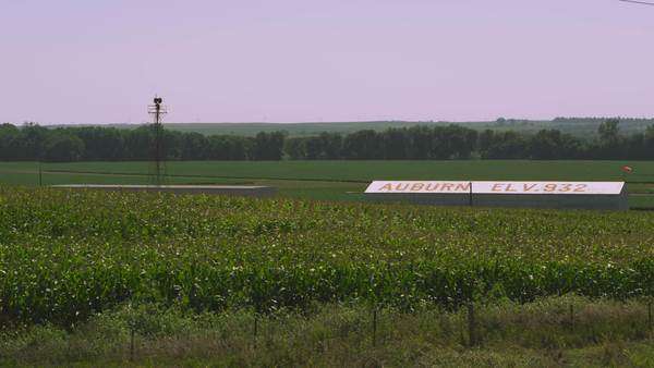 Static shot of corn field and buildings showing the elevation in Auburn ...