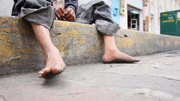 A homeless man sits on the curb in a small town in Mexico - Stock Video ...