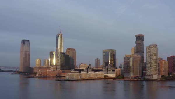 Aerial: Sun glaring off the windows of the high rise buildings in New ...