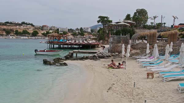 ALBANIA, KSAMIL, 28 SEPTEMBER 2021: Azure beach with sun loungers and ...