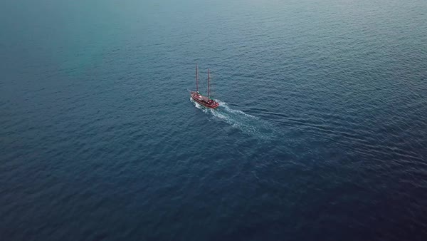 Bird eye view on a boat at open sea in the middle of nowhere. Sailing ...