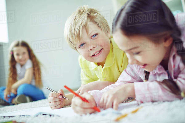 Cute boy with pencil and his friend drawing together - Royalty-free ...