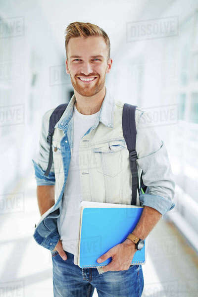 Portrait of smiling college student - Royalty-free Stock Photo | Dissolve