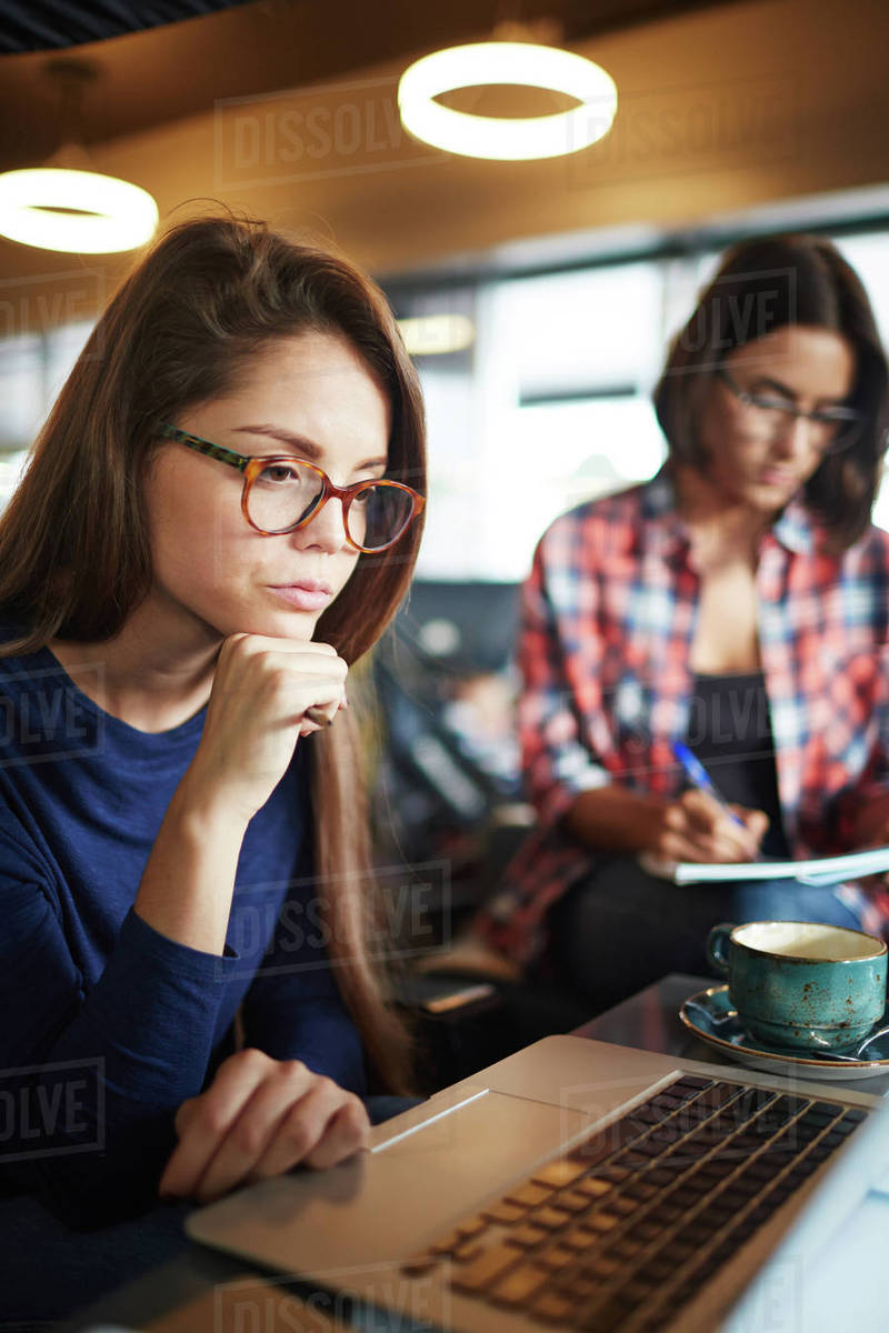 Caucasian student sitting in front of laptop - Royalty-free Stock Photo ...
