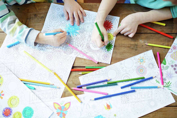 Kids coloring pictures with crayons and highlighters - Royalty-free ...