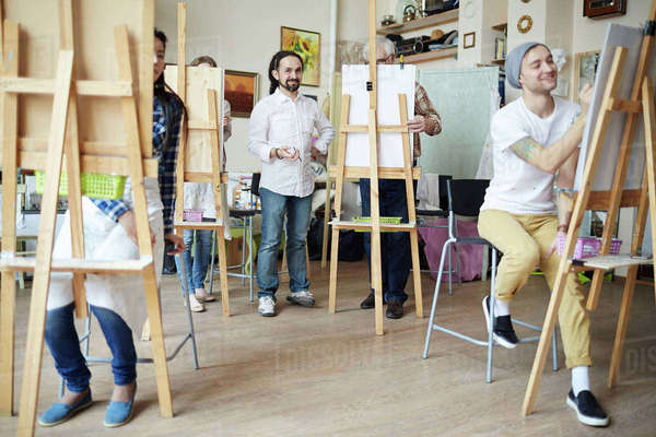 People working on a painting at an art school - Royalty-free Stock ...