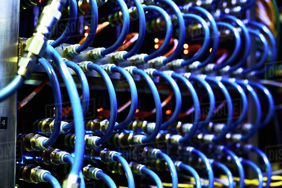 Network hub and server rack with blue connection cables - Royalty-free ...