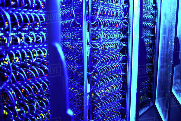 Background of servers in a data centre - Stock Photo - Dissolve