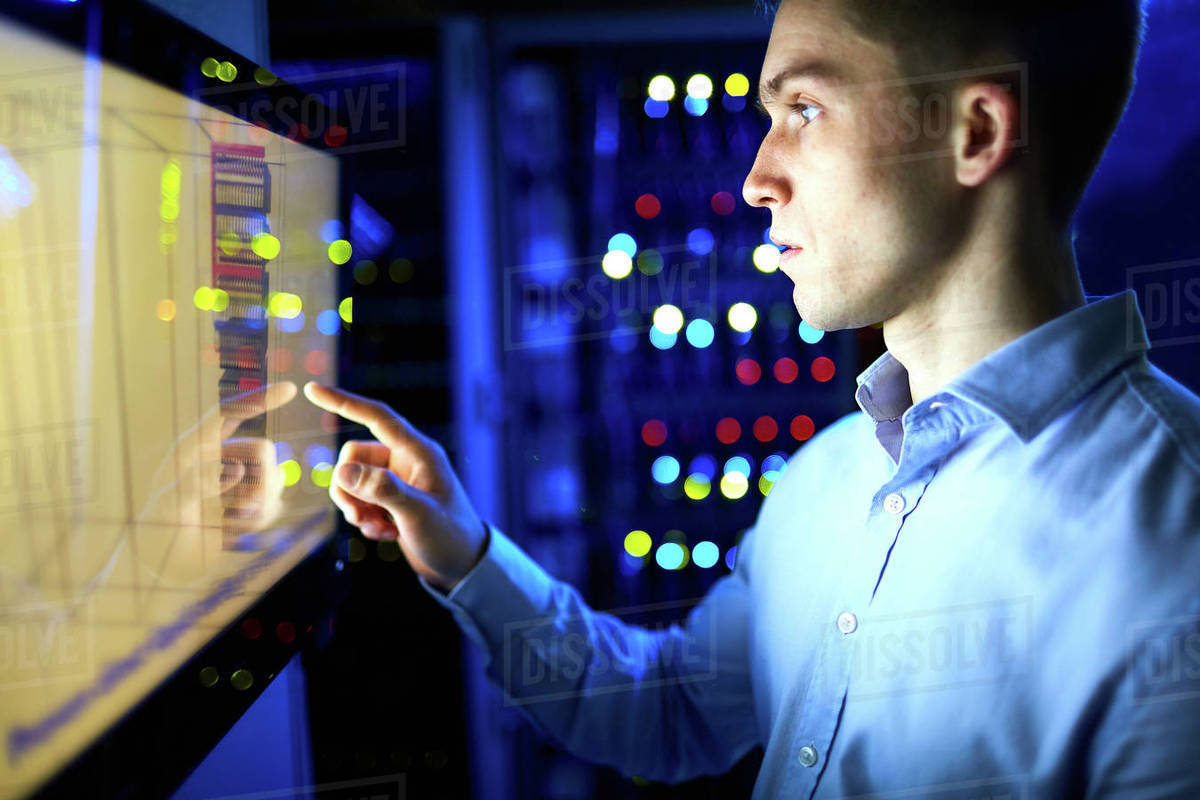 Engineer working with touchscreen in a data centre - Royalty-free Stock ...