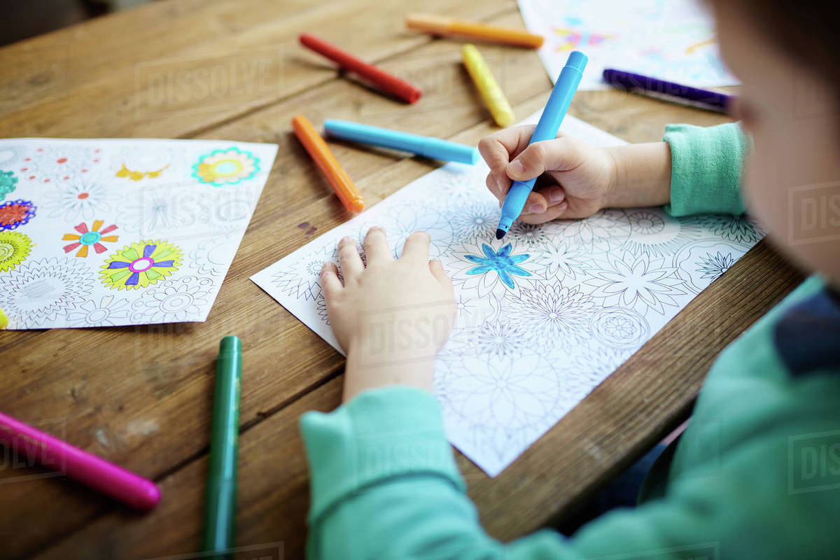 Little boy coloring creative pictures with highlighters - Royalty-free ...