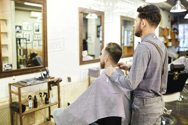 Barber consulting with his hipster customer - Royalty-free Stock Photo ...