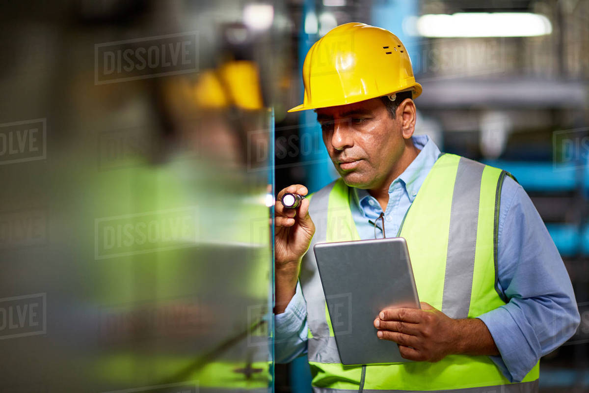 Engineer with small flash light and touchpad - Royalty-free Stock Photo ...