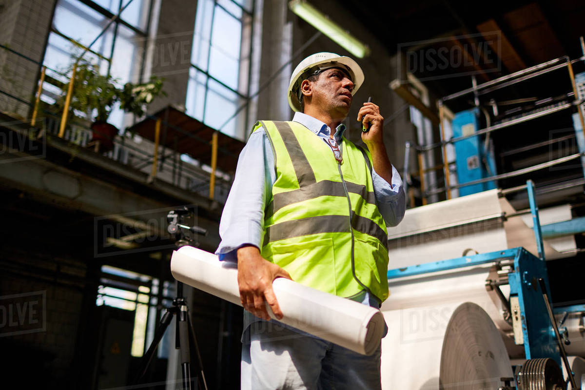 Engineer talking by portable radio transmitter - Royalty-free Stock ...