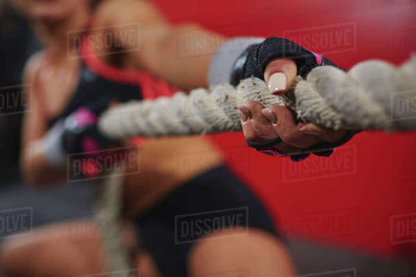 Hands of woman holding rope - Royalty-free Stock Photo | Dissolve