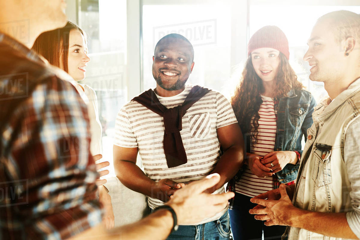 Group of teenagers having friendly talk - Royalty-free Stock Photo ...