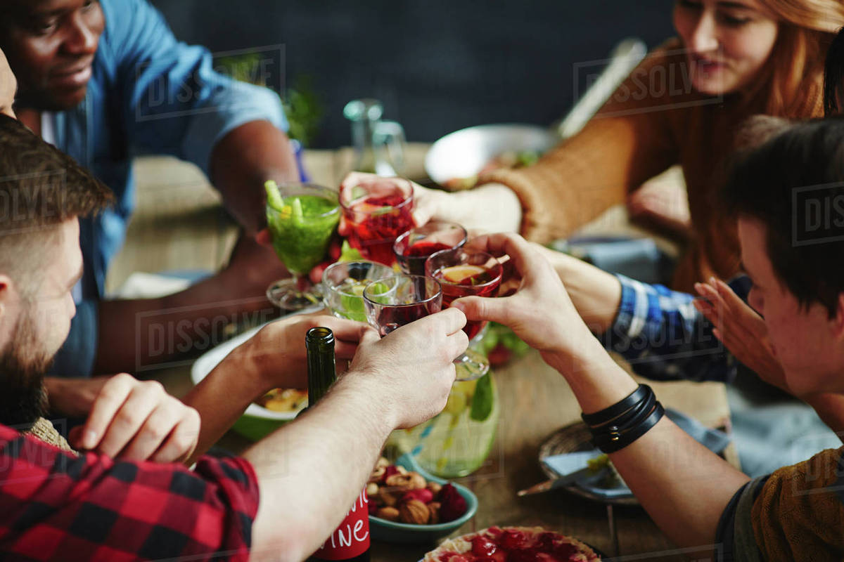 Friends toasting at informal gathering - Royalty-free Stock Photo ...