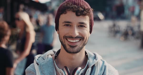 Portrait of happy cute man smiling in city, slow motion - Stock Video ...