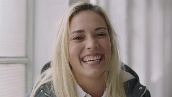Close up portrait of beautiful young blonde woman laughing - 4K Royalty ...