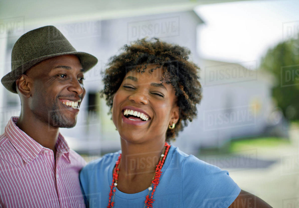 Couple smiling together. - Royalty-free Stock Photo | Dissolve