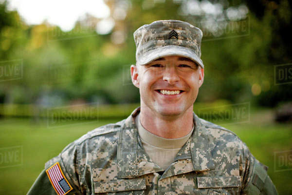 Portrait of a smiling male soldier. - Royalty-free Stock Photo | Dissolve