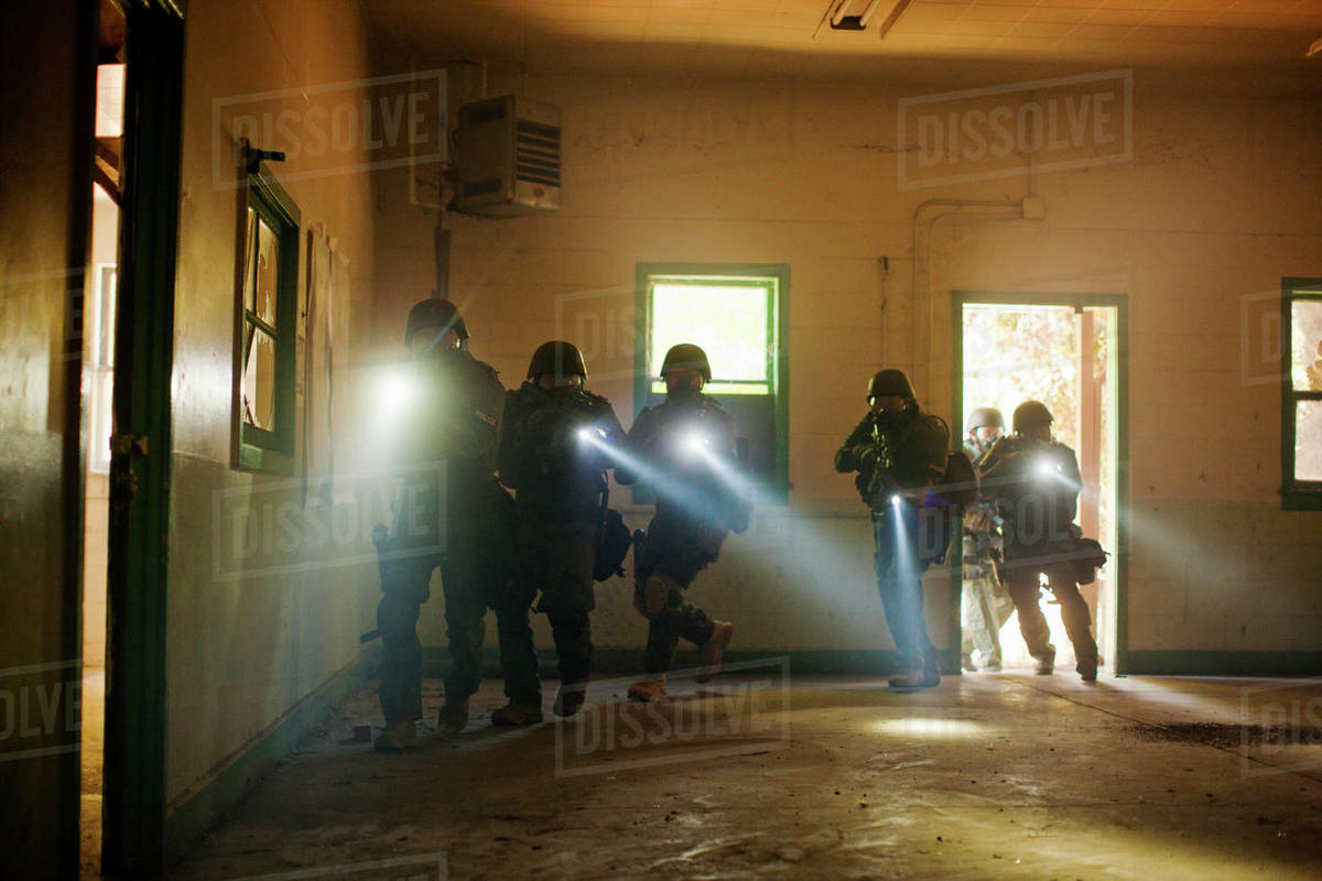 Group of police officers inside a building during an exercise at ...