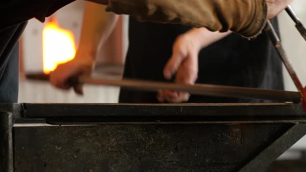 Glassworks glass manufacturing, process of forming a decorative peace ...