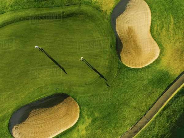Golf course top view with players. Aerial view of golfers on putting ...