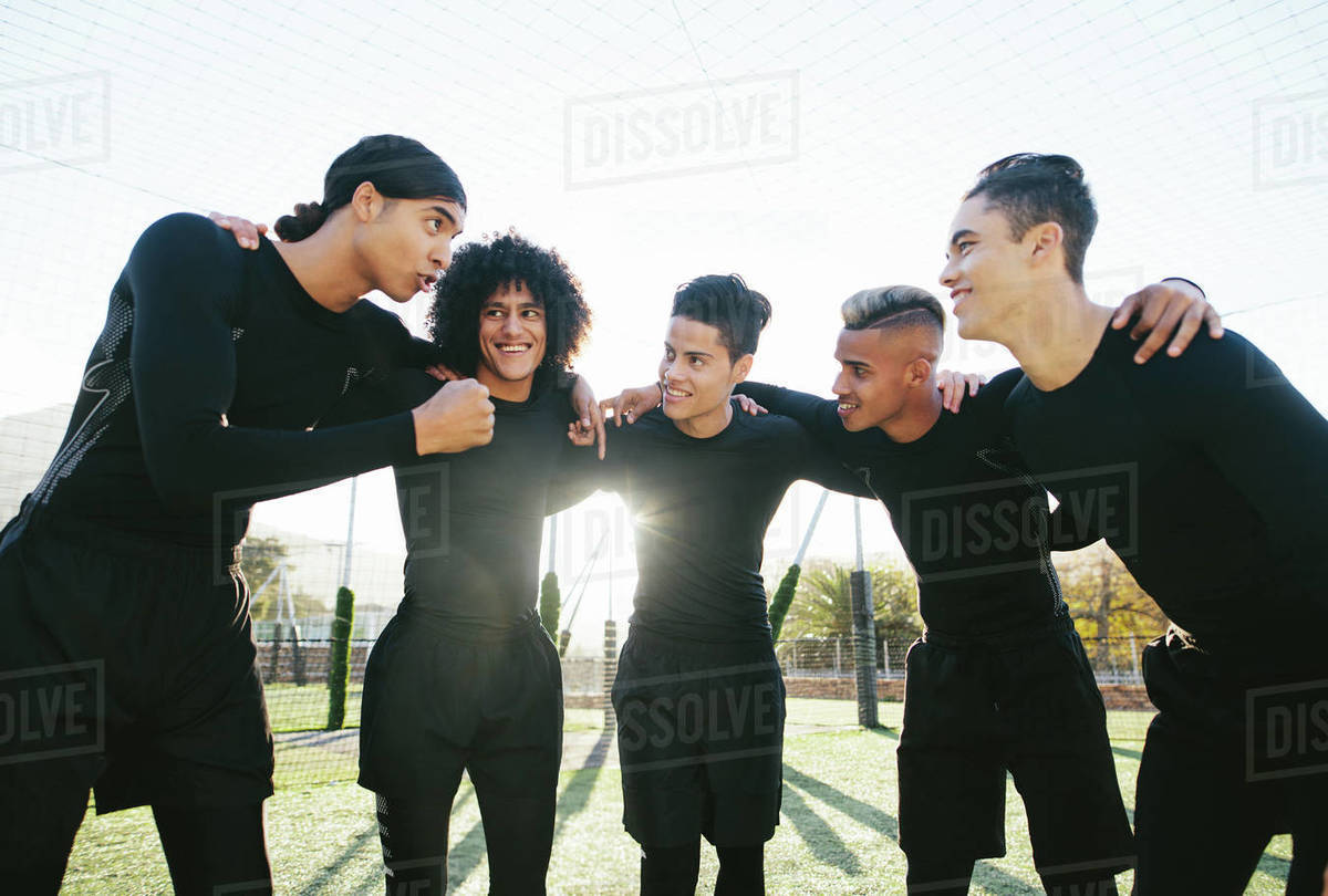 Young sports team on soccer field before the game. Football players ...
