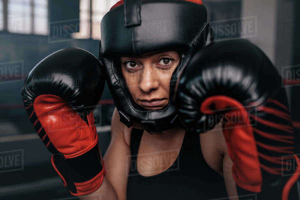 Close up of a female boxer in her boxing gear. Woman boxer at a boxing ...