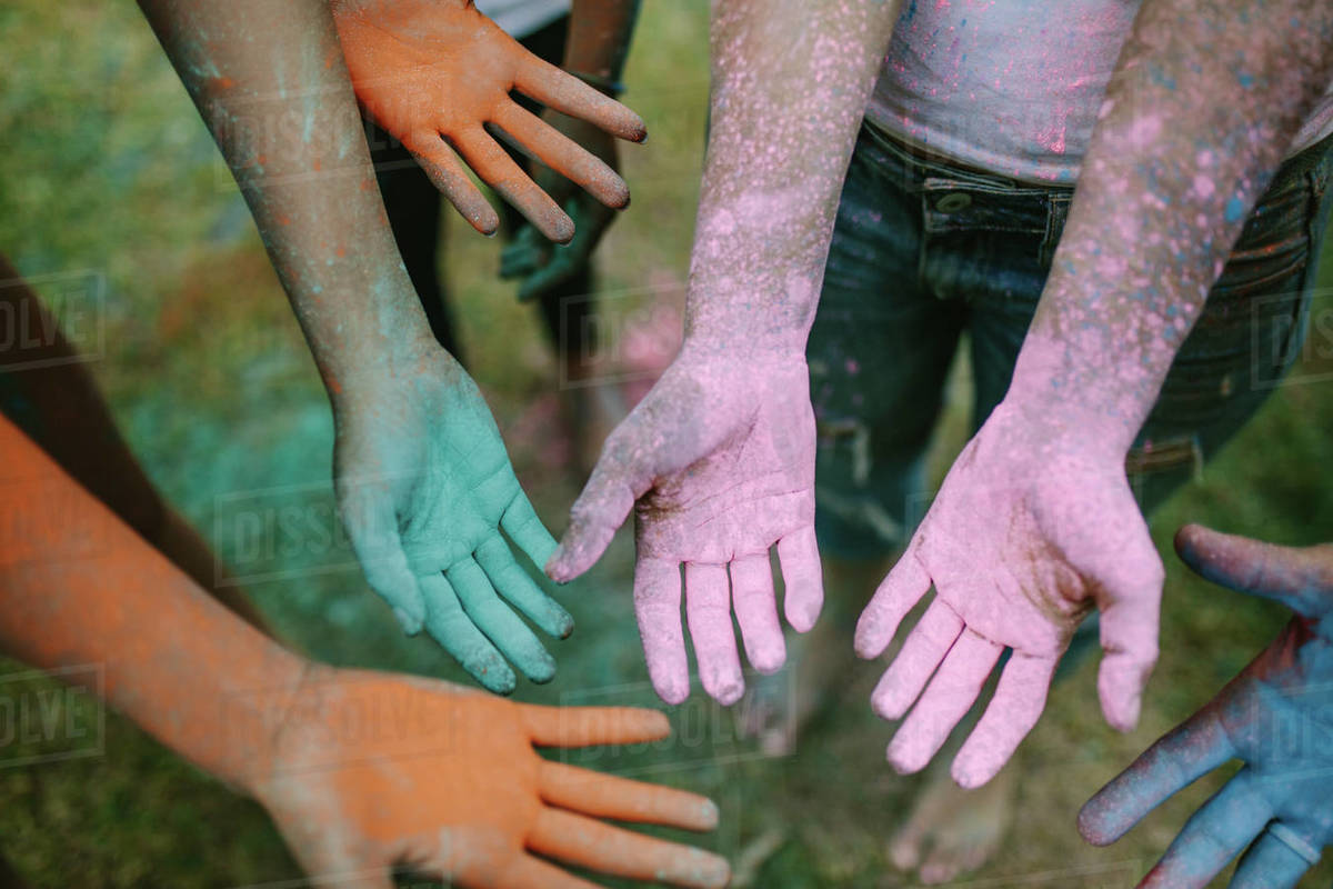 Friends playing with colored powder in a park - Royalty-free Stock ...