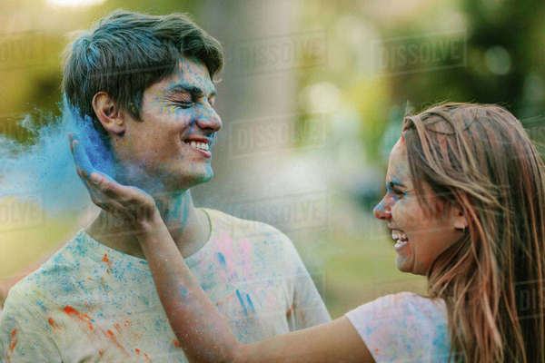 Friends playing with colored powder in a park - Royalty-free Stock ...