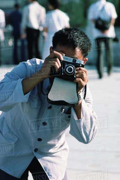 Man taking a picture with a camera, Beijing, China - Royalty-free Stock ...