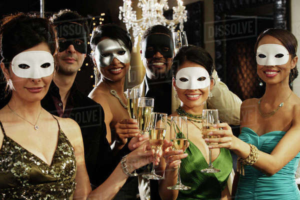 Portrait of multi-ethnic friends at masquerade party - Royalty-free ...