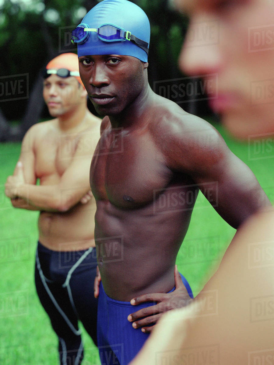 Multi-ethnic male swimmers outdoors - Royalty-free Stock Photo | Dissolve