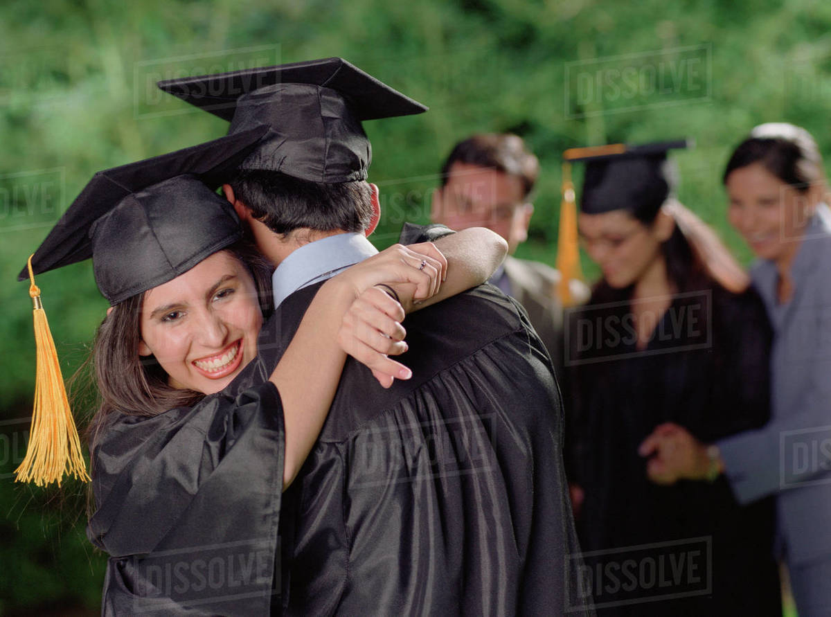 Graduates hugging - Royalty-free Stock Photo | Dissolve
