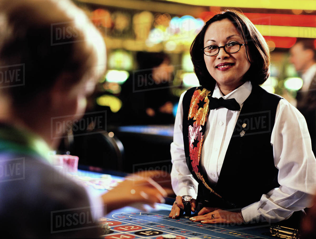 Woman dealer in casino - Royalty-free Stock Photo | Dissolve