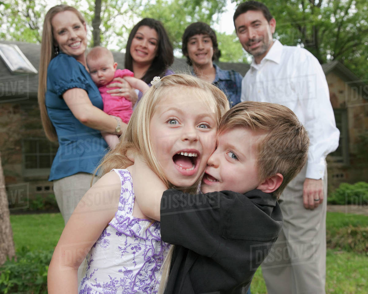Family standing in front yard together - Royalty-free Stock Photo ...