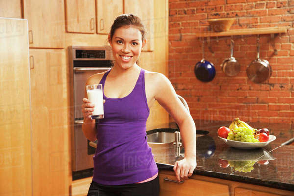 Hispanic woman drinking milk after exercise - Royalty-free Stock Photo ...