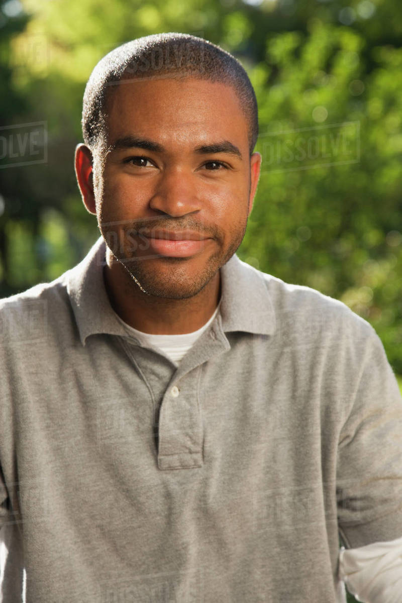 Smiling Black man outdoors - Royalty-free Stock Photo | Dissolve