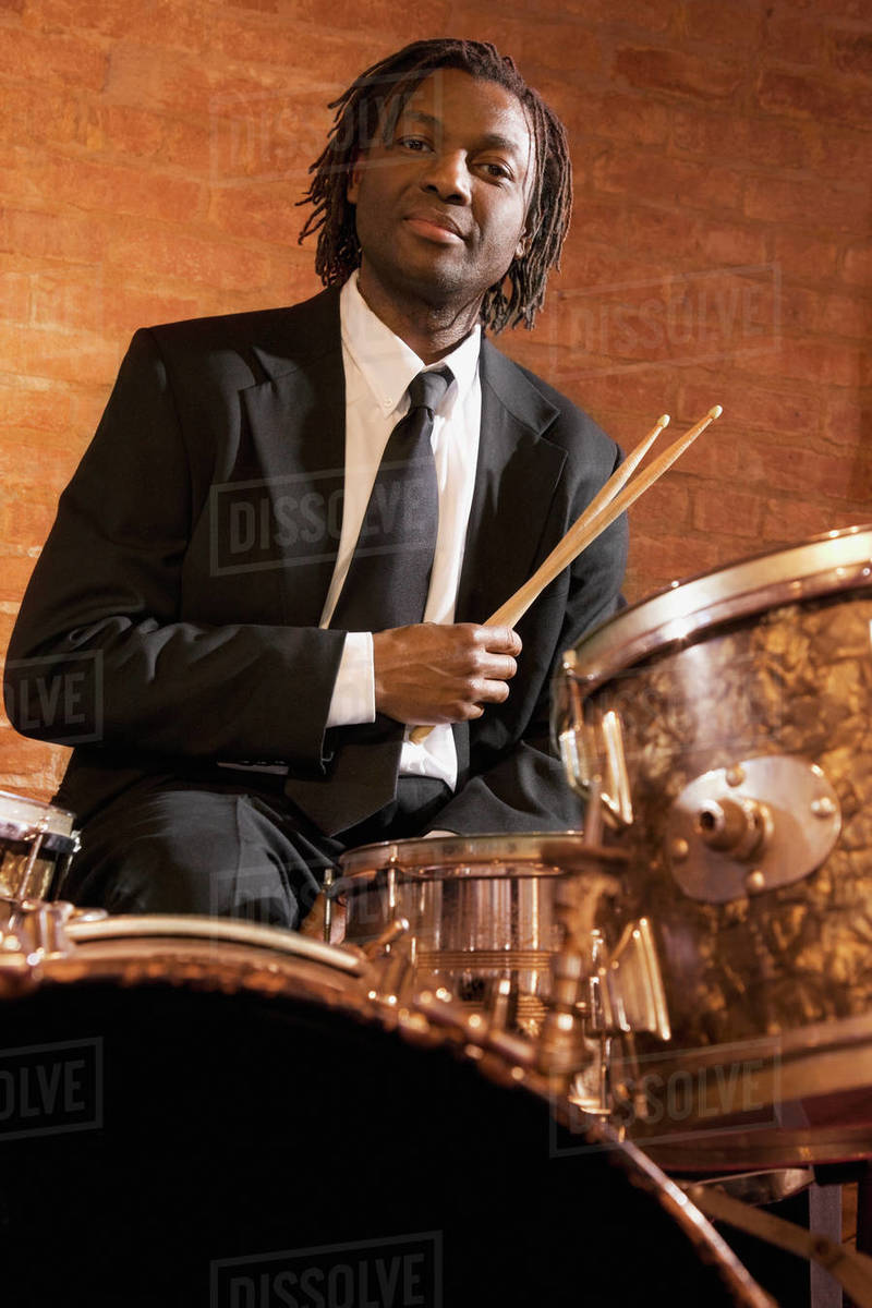 African man playing drums - Stock Photo - Dissolve